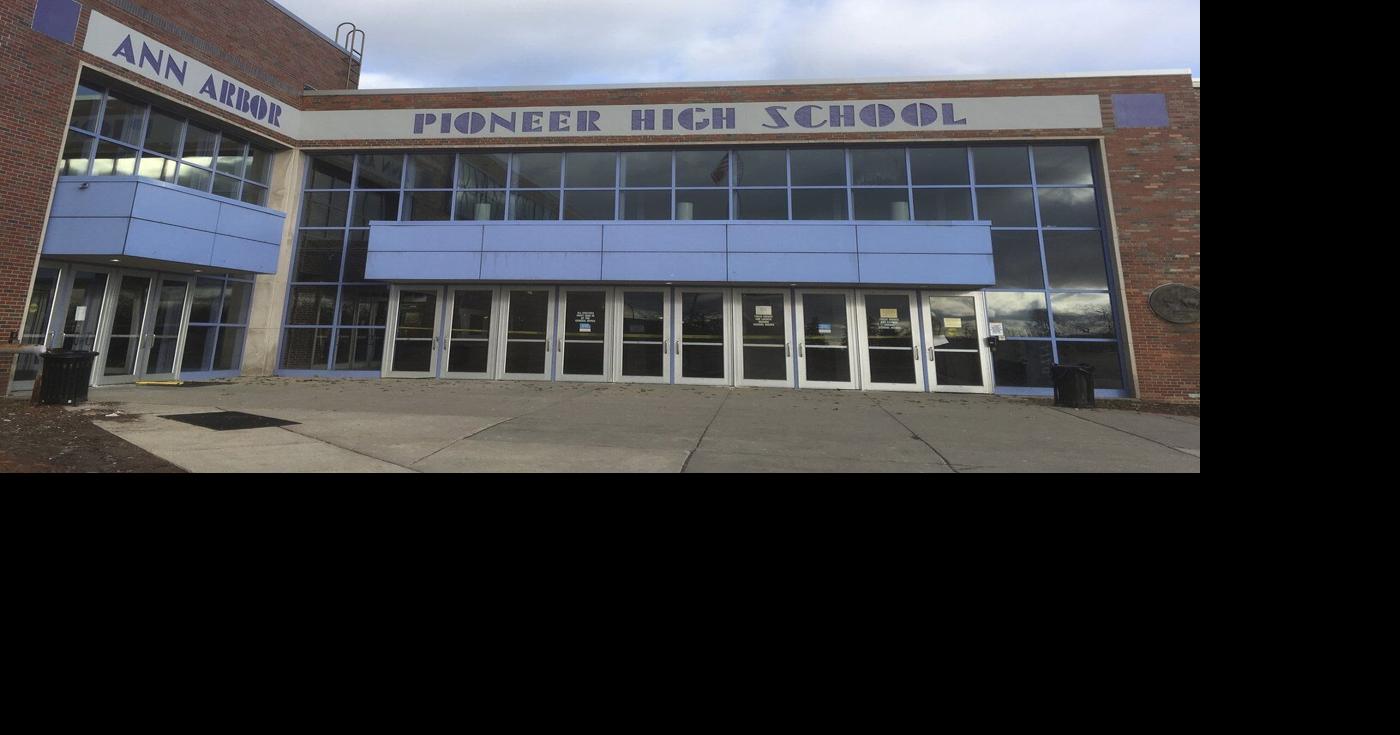 University of Michigan basketball fans return to high school lot to ...