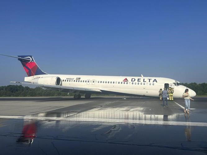 Delta passengers exit flight using jet slide after plane lands without ...