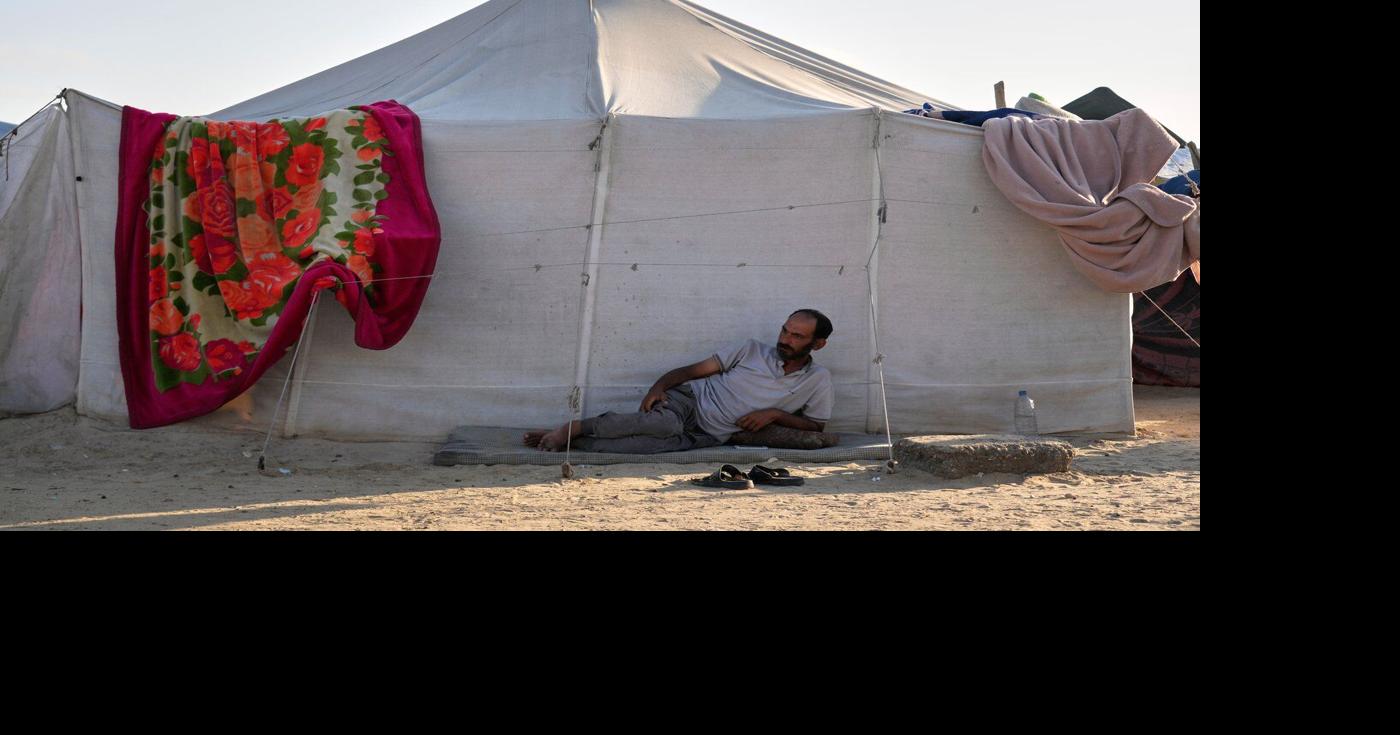 Palestinians walk long distances to fetch water and ration each drop ...