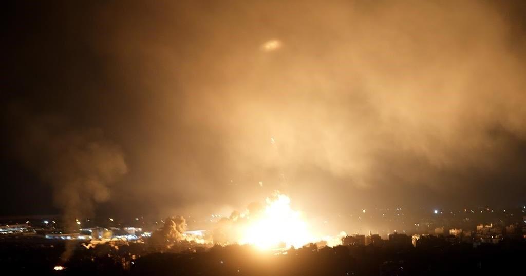 Israeli airstrikes rock southern suburbs of Beirut and cut off a key ...