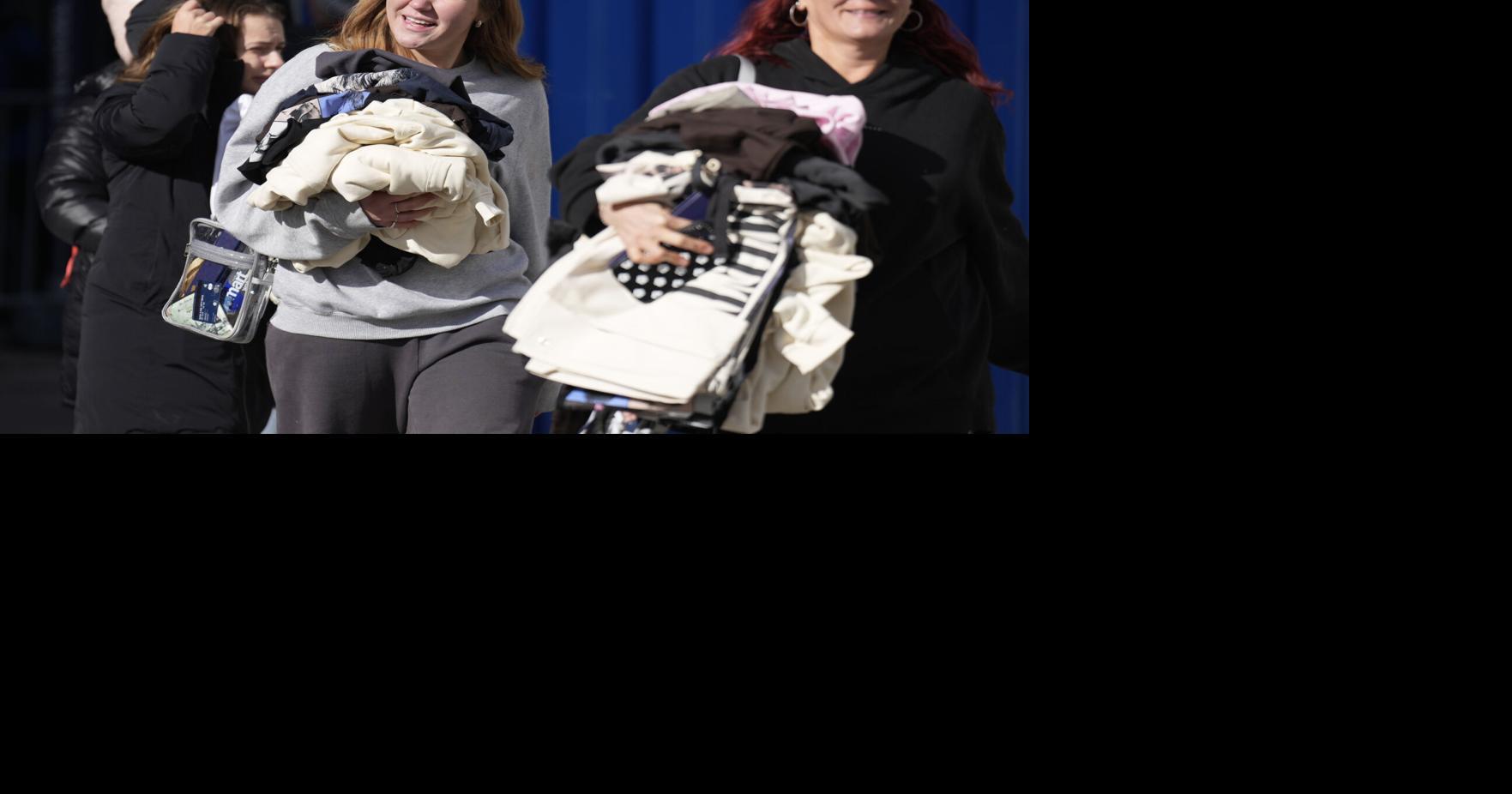 'It's literally incredible': Swifties line up for merch ahead of ...