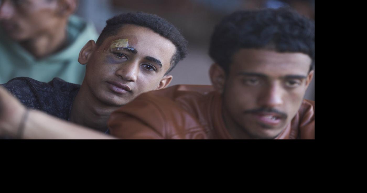 Photos show migrants intercepted near Crete arrive at the Greek port of ...