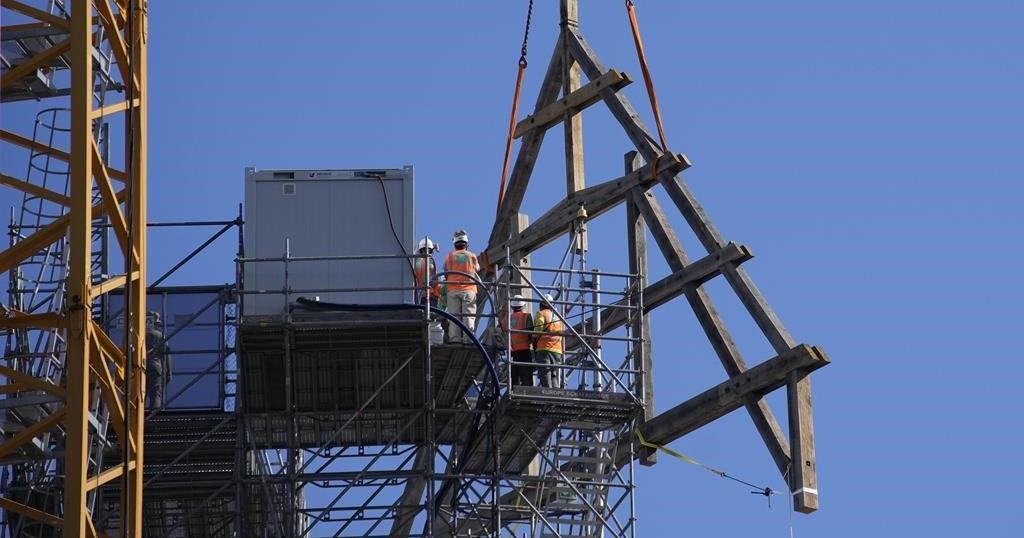 Oak trusses raised to roof of fire-ravaged Notre Dame Cathedral as ...