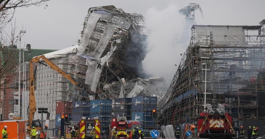 Firefighters tackle scaffolding dangling outside ruins of fire-ravaged ...