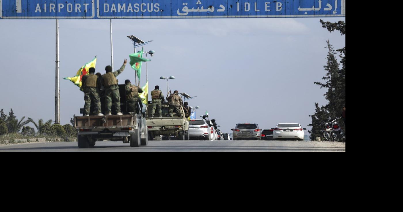 Kurdish fighters leave northern city in Syria as part of deal with ...