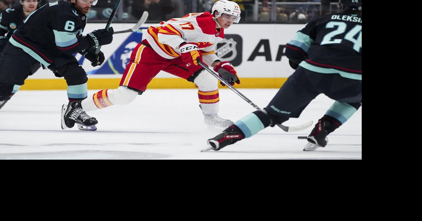 Flames score three times in first period, hang on to beat Kraken 3-2 ...