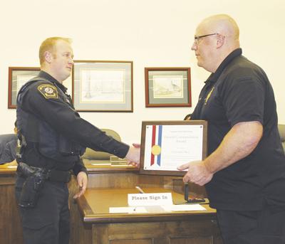 Police officer earns award for coordinating Christmastime program ...
