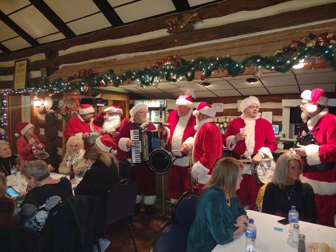 Singing Santas spread Christmas cheer with popular musical performances ...
