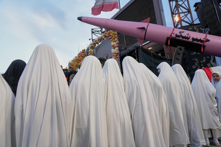 Photos of a mass wedding and a colorful missile at Tehran's 'Sacrifice ...