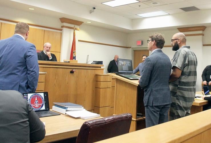 One held, one out on bond, as manhunt continues for Kenneth Wayne ...