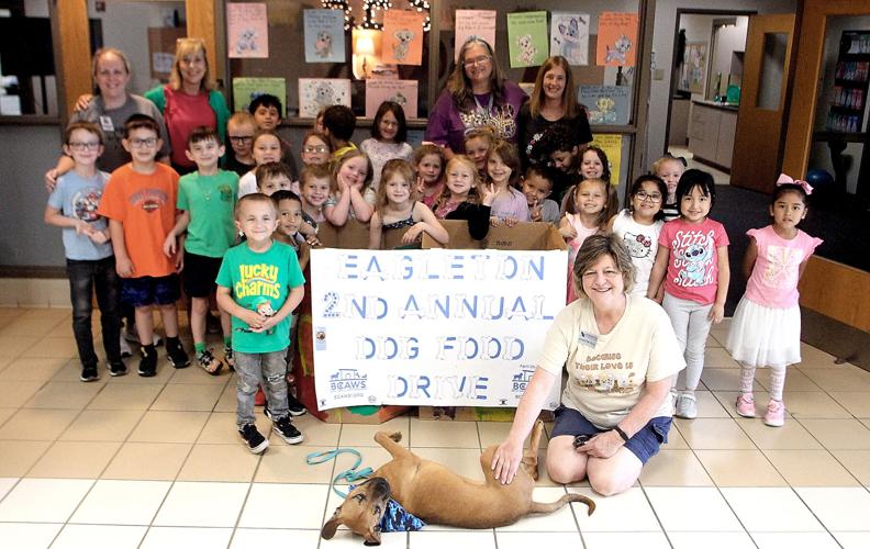 All smiles for belly rubs: Eagleton students collecting pet food ...