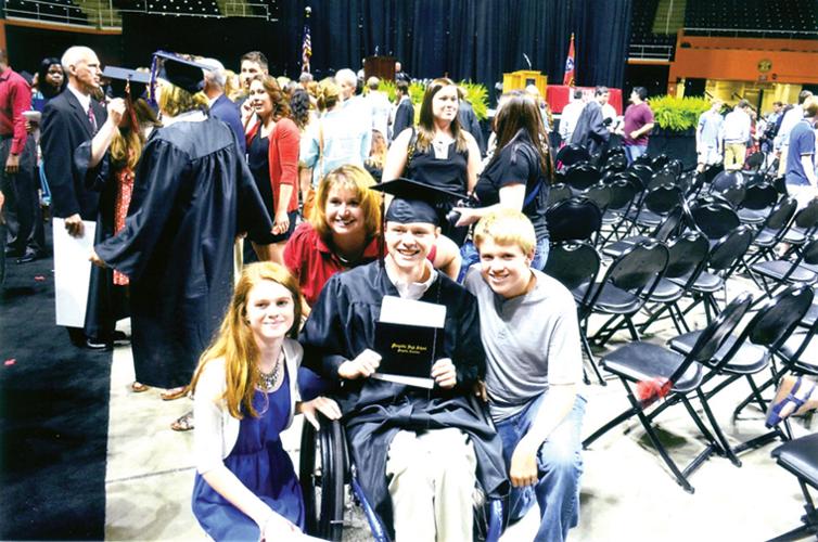 Crowd erupts as MHS graduate Nathan Odom walks across stage | Community ...