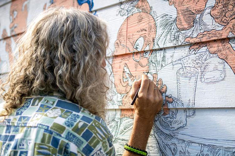Artist Michael Alexi adds another mural to downtown comic store, The ...