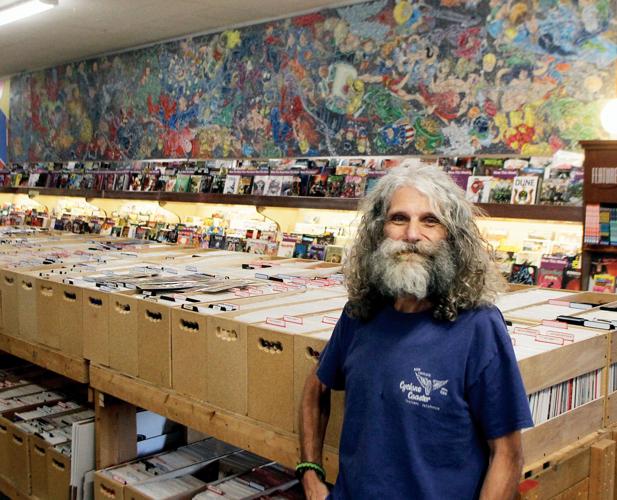 Artist Alexi unveils massive mural in Maryville comic book shop | News ...