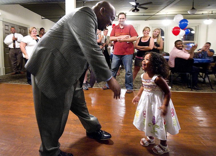 |Erin Parsons (right), 3, runs to hug her father, Jarvis Parsons, after ...