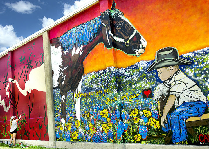 Painters brighten Downtown Bryan building with series of murals
