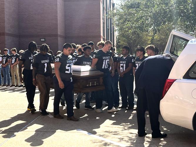 Bryan football team, band attend Green's funeral