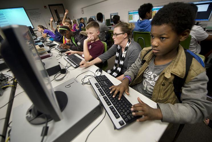 Kids learning computer code in after-school clubs