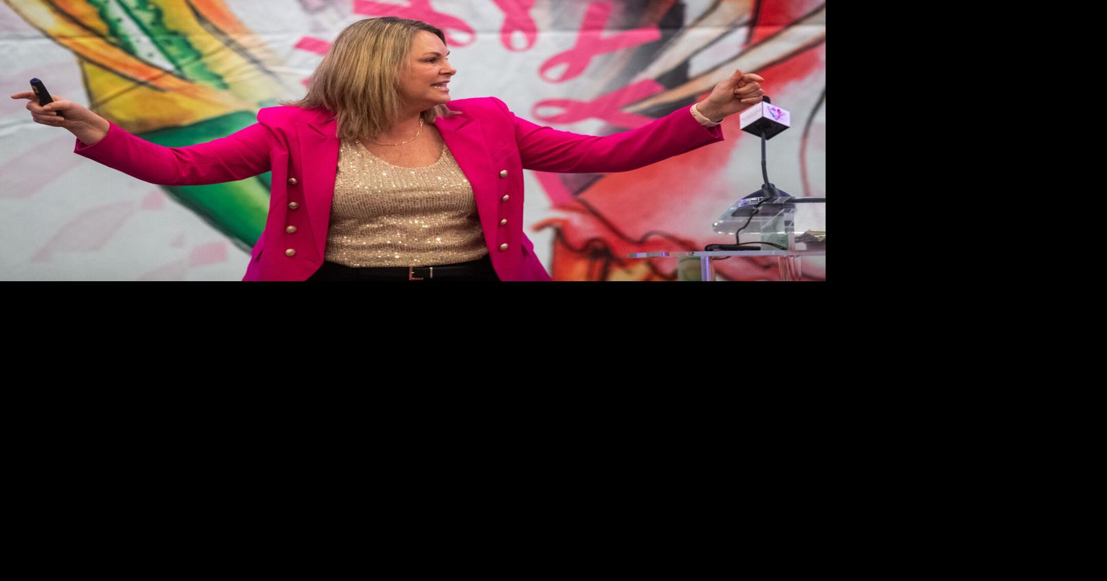 Breast cancer survivor Kim Becking speaks at luncheon