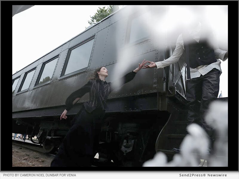 As if she's running for the train, a woman reaches her hand out to be ...