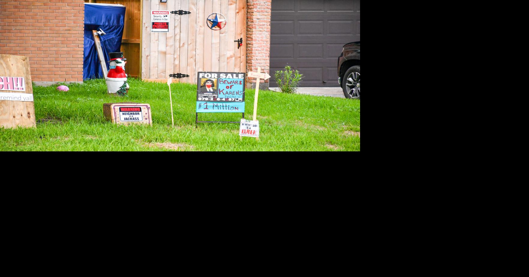 Whose side of the fence are you on: Neighbors dispute signage and ...