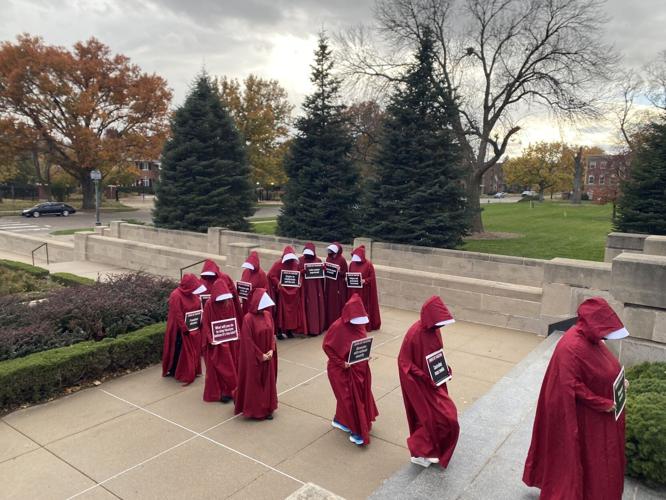 Silent handmaids in red unsettle Nebraska’s top Republicans