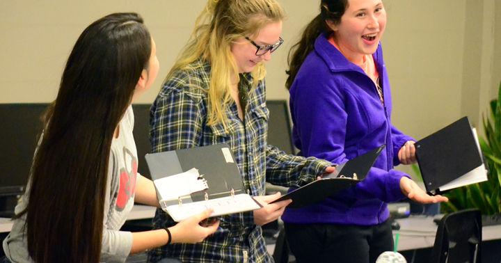 Three forensics teams come together to practice their speaking skills