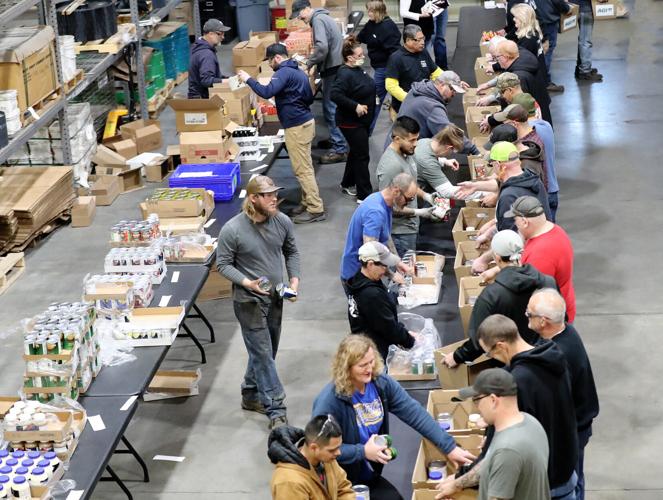 HOLIDAY CHEER: AGI packs food baskets for families