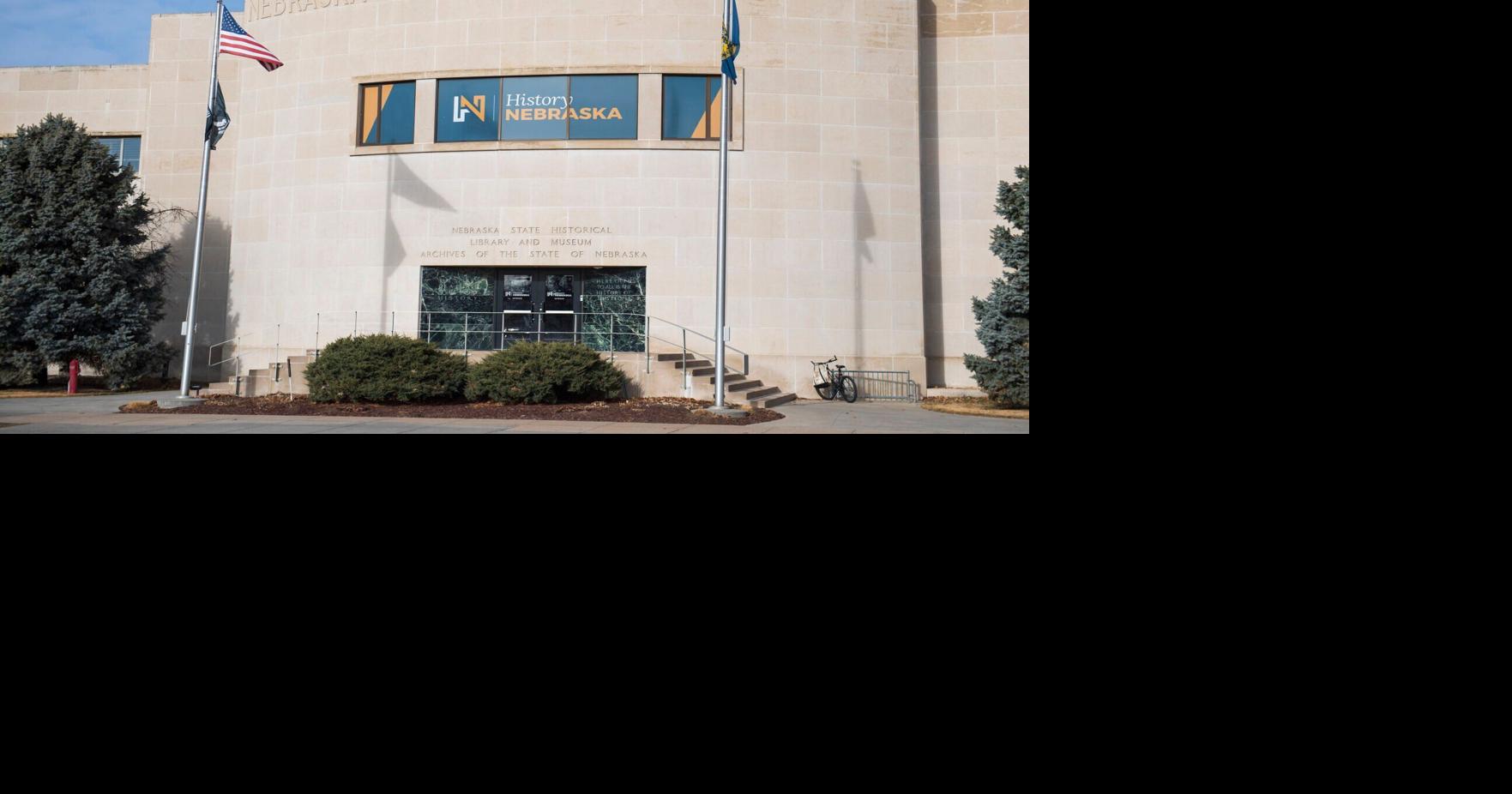 Former history director charged with improper transfer