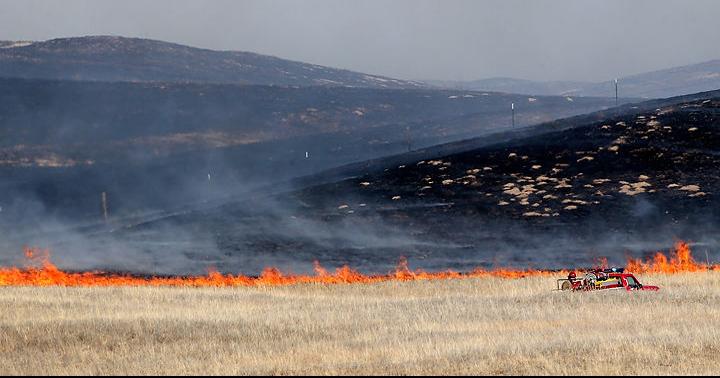 Winds, humidity fan wildfires