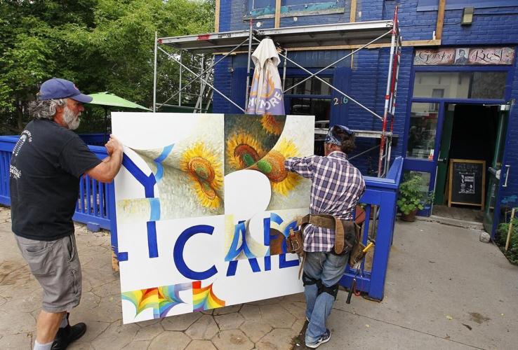 Photos: Local artist creates new signage for popular downtown ...