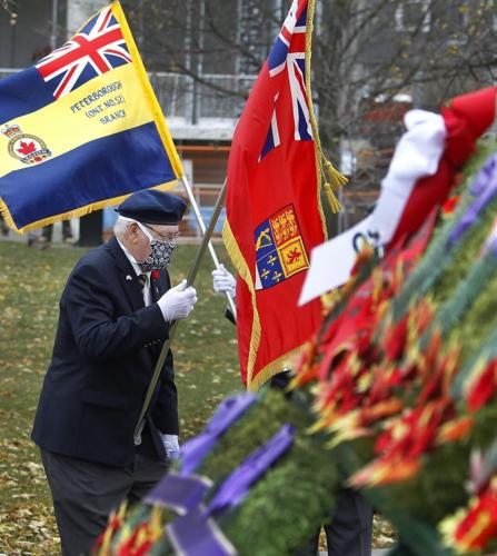 Poppy proud: 100 attend scaled-back ceremony marking Remembrance Day in ...