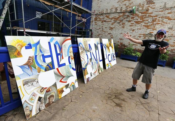 Photos: Local artist creates new signage for popular downtown ...