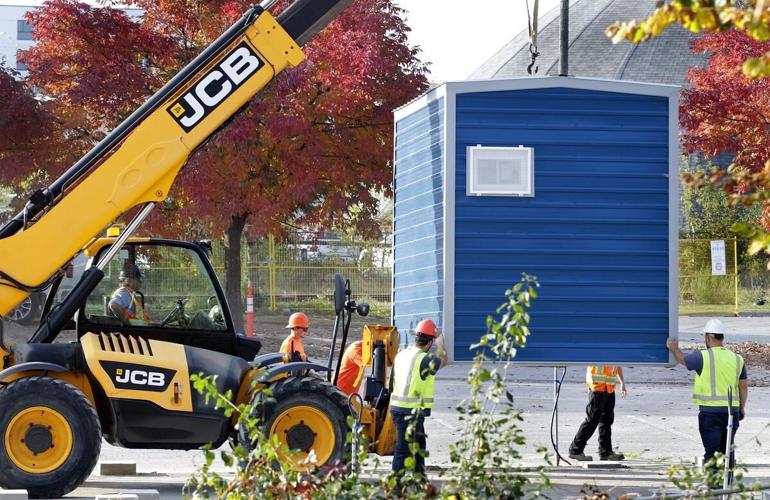City expects people to move into modular cabins this month