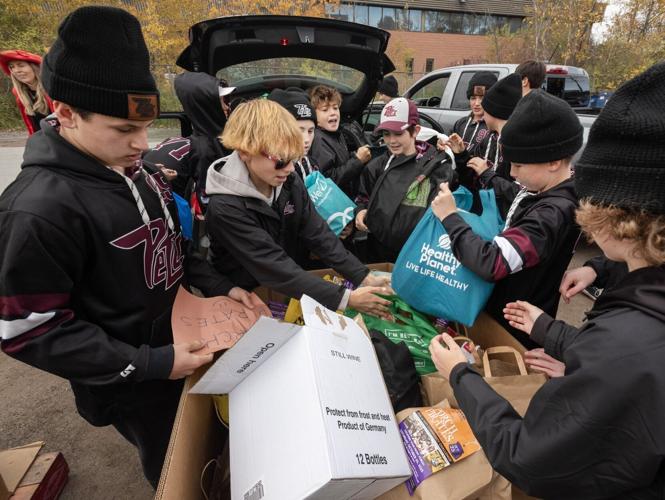 Photos: Porch Pirates for Good help stock food bank shelves