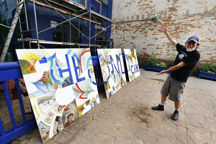 Photos: Local artist creates new signage for popular downtown ...