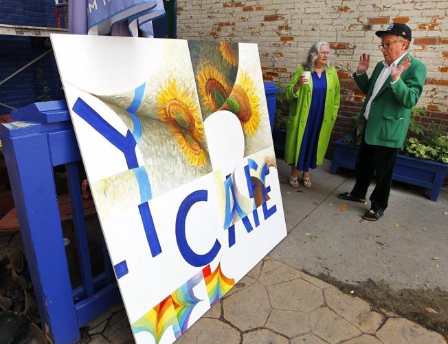 Photos: Local artist creates new signage for popular downtown ...