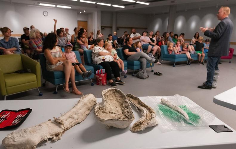 Discovering Dinosaurs drop-in program held at city library