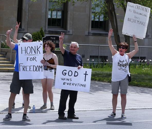 Photos: Police monitor protest outside Peterborough City Hall