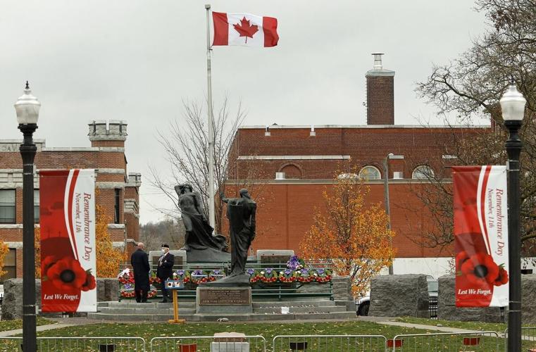Poppy proud: 100 attend scaled-back ceremony marking Remembrance Day in ...