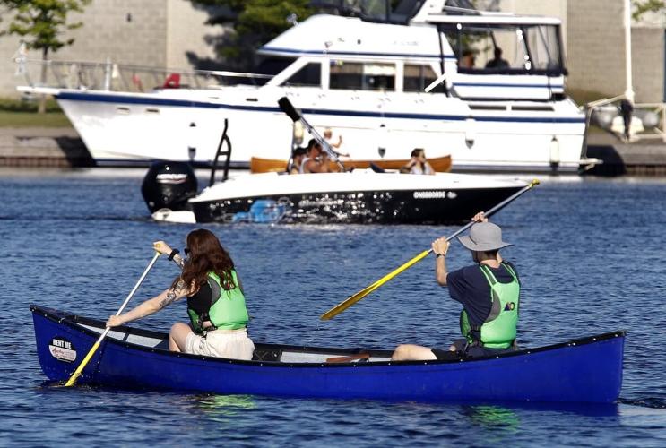 Photos: People take to waters in canoes, kayaks for Family Paddle Day ...