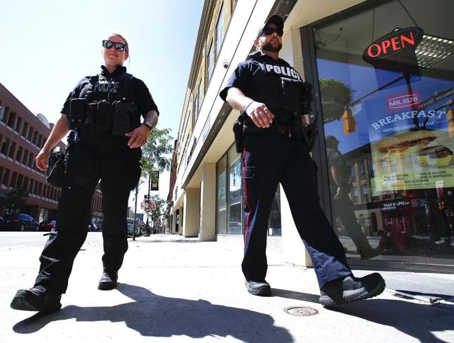 Photos: City police officers conducting foot patrols in downtown ...