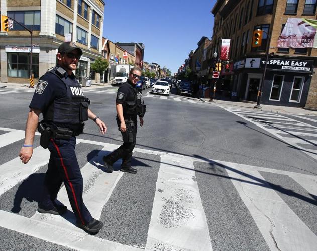 Photos: City police officers conducting foot patrols in downtown ...
