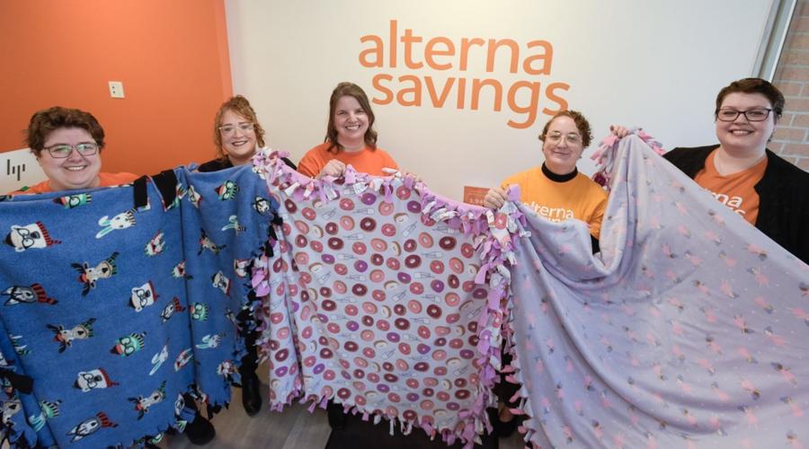 Volunteers craft blankets for Kids at Christmas campaign