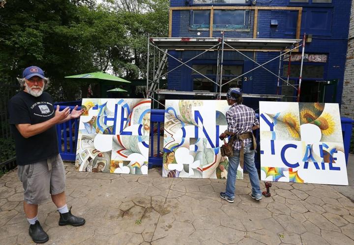 Photos: Local artist creates new signage for popular downtown ...
