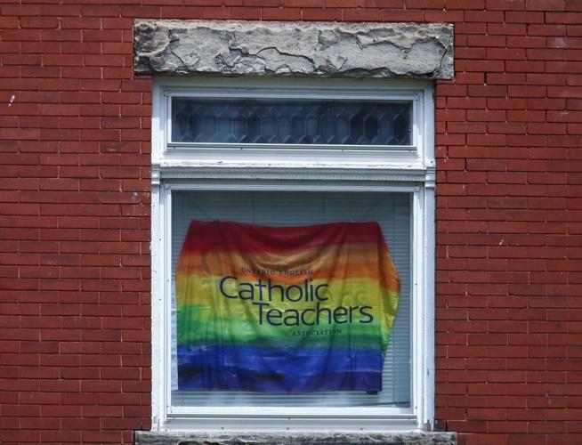 Pride flag laid on lawn of Catholic school board headquarters in ...