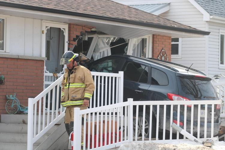 Photos: Car crashes into living room of house in Peterborough