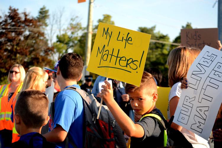 Frustrated families protest Bolton by-pass bus route cancellation