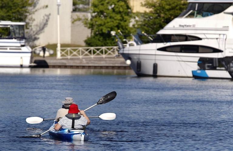 Photos: People take to waters in canoes, kayaks for Family Paddle Day ...