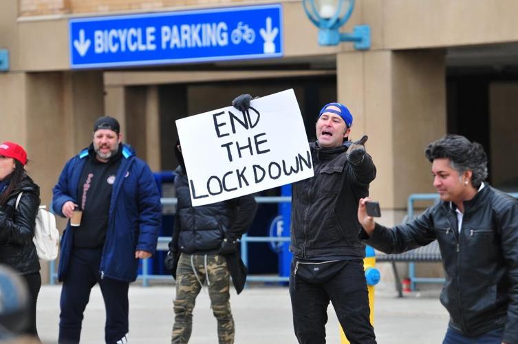Dozens gather in Waterloo square to protest lockdown order